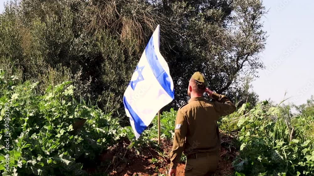 Soldier IDF salutes the Flag of Israel. Video concept: Israeli soldier ...