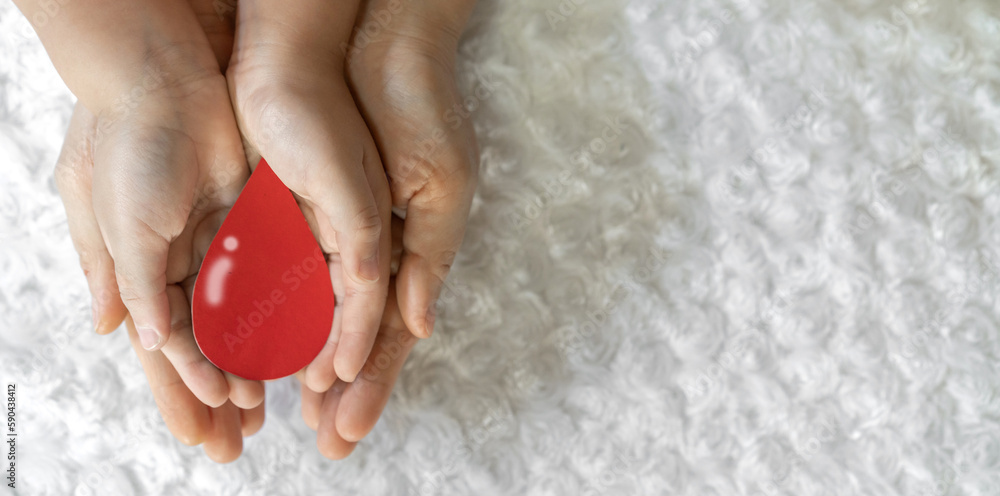 Hand holding blood drop donation, save life, world hemophilia day ...