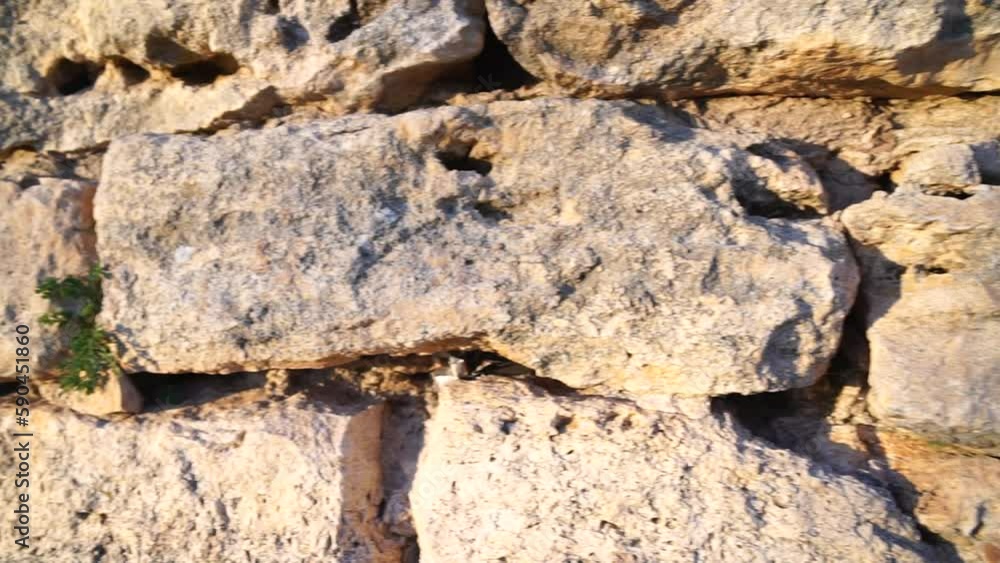 Ancient Stone Wall - Limestone. Fence is made of crude stone limestone ...