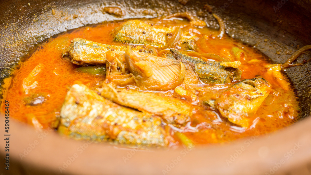 Mackerel fish curry with gravy in tomato sauce in a pot. Stock Photo ...