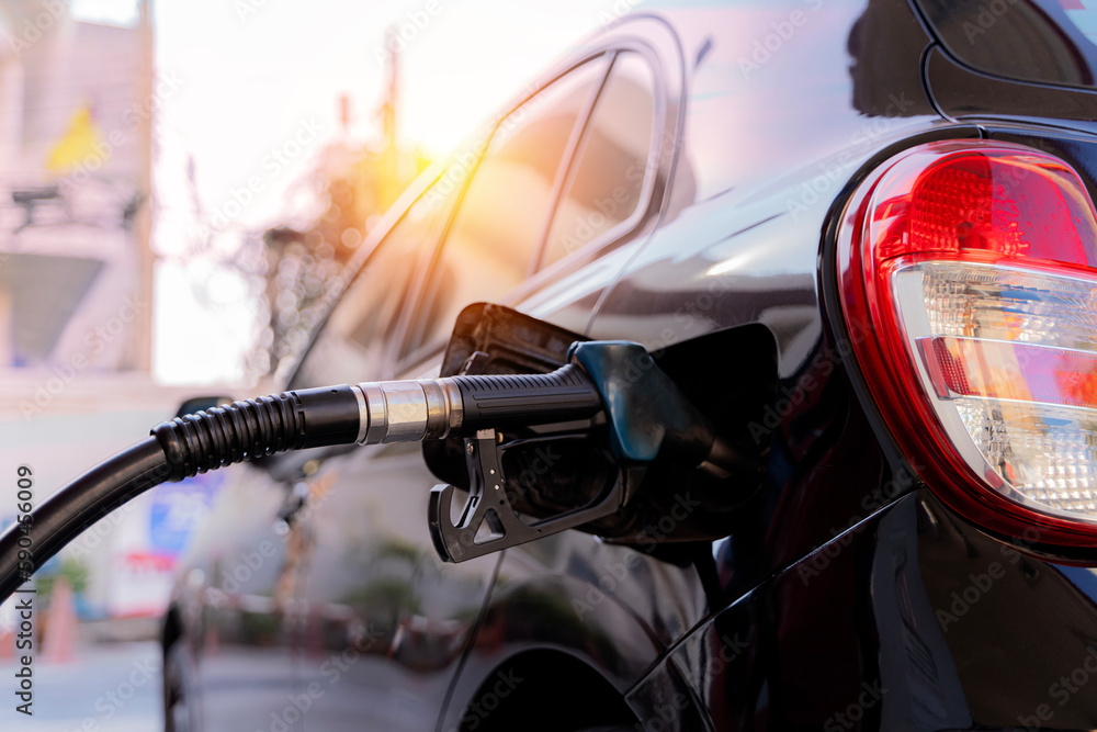 car gas nozzle automatic refueling Refueling with premium gasoline at a ...