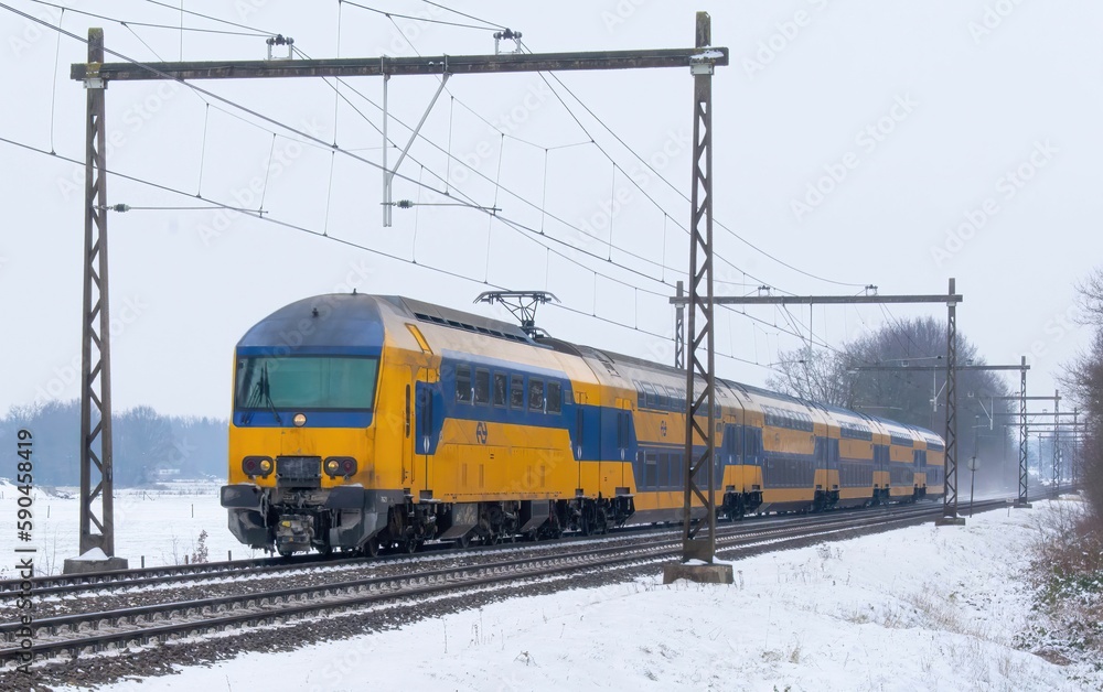 Dutch double decker intercity train in a snowy landscape Stock Photo ...