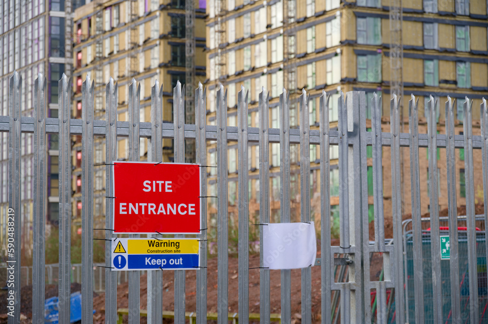 Site entrance sign on fence boundary at construction site Stock Photo ...