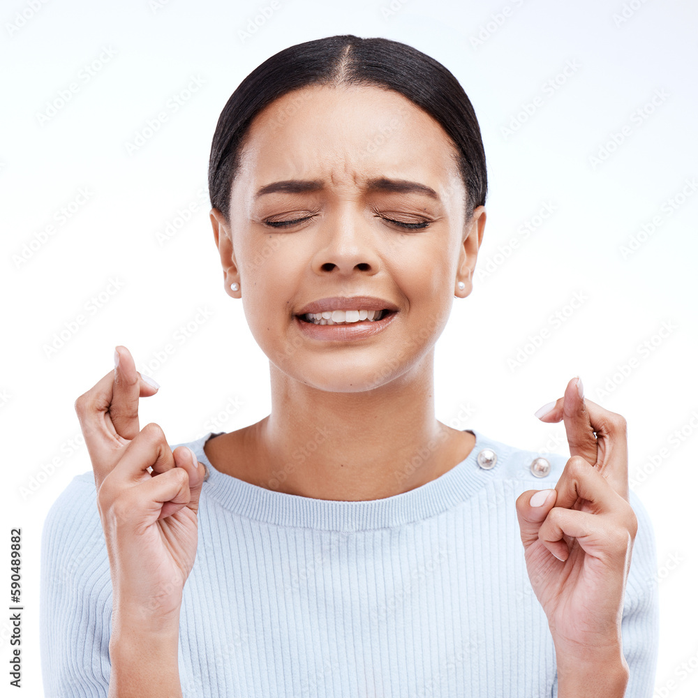 Fingers crossed, hope and woman thinking for luck in a studio with wish ...