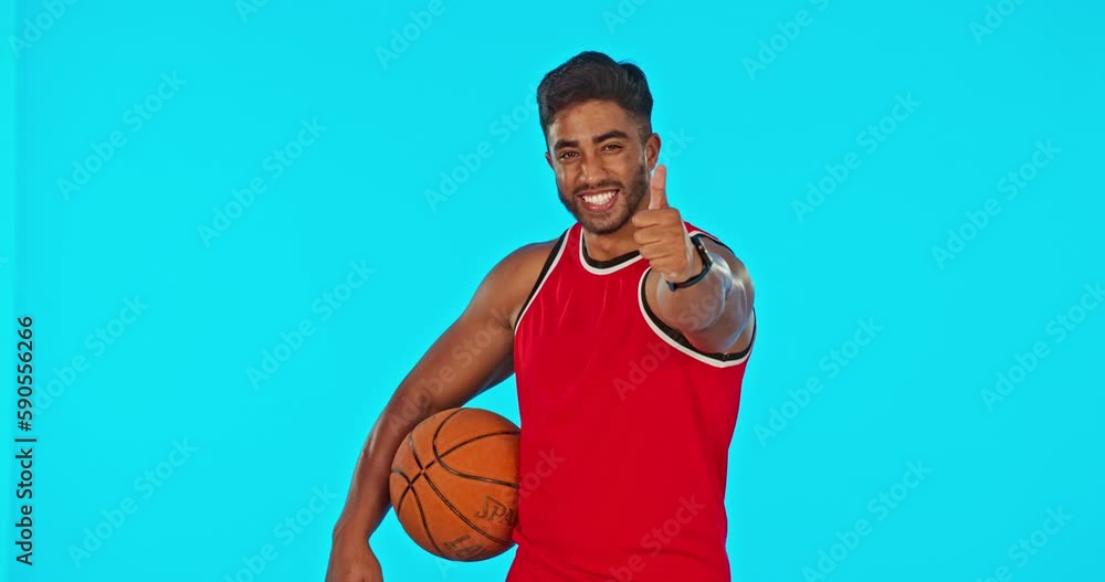 Man, basketball and thumbs up for success in sports isolated in studio ...