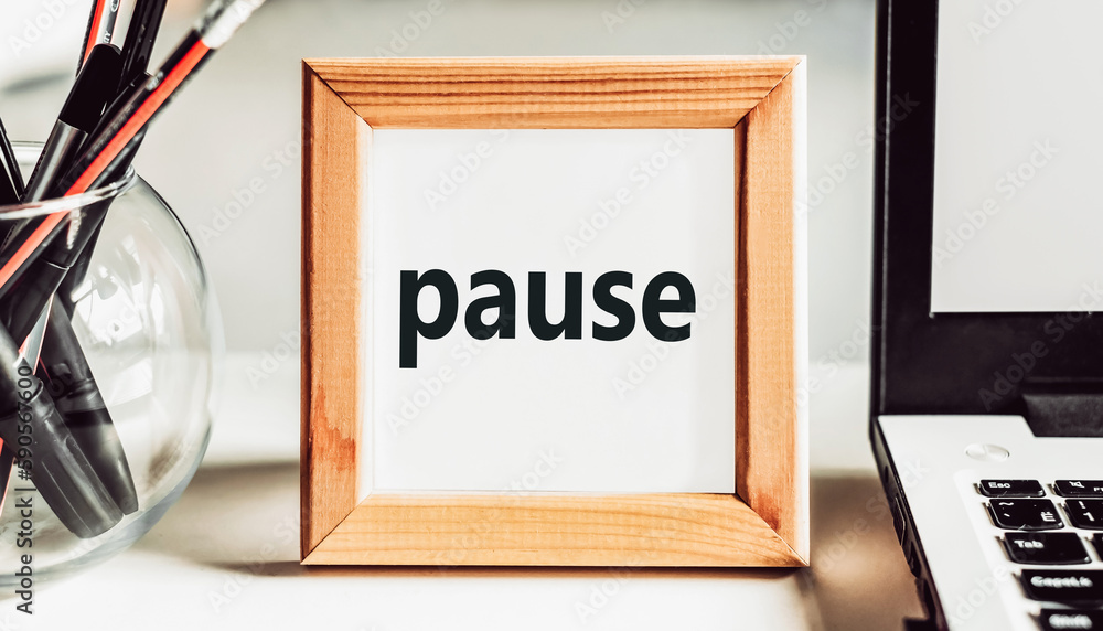 Pause. Work, study, break and rest concept. Text on a frame with an ...