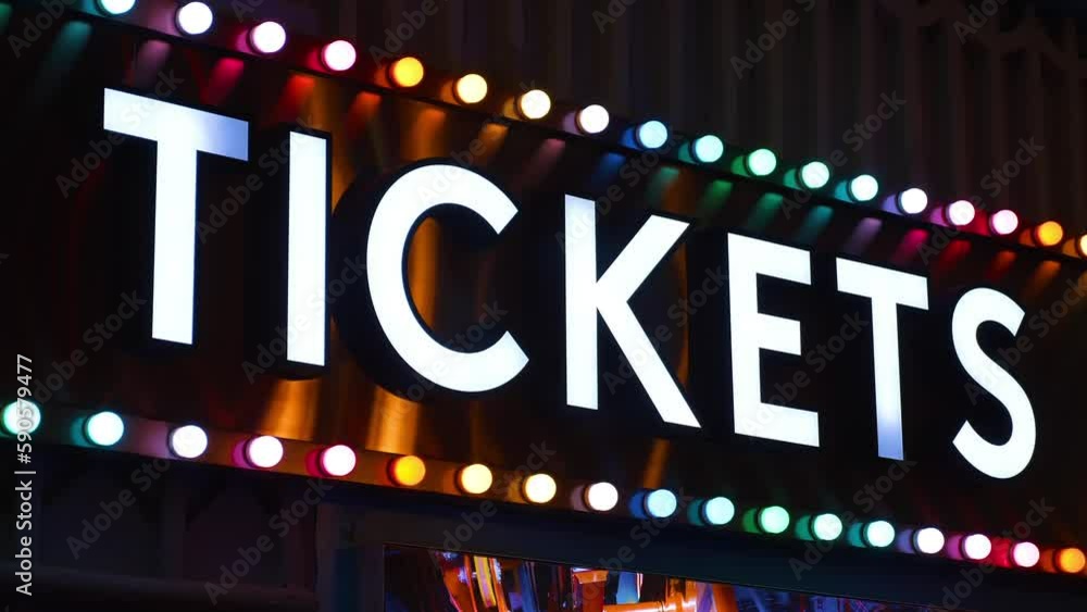 Amusement park - tickets glow sign at carnival, illuminated in night ...