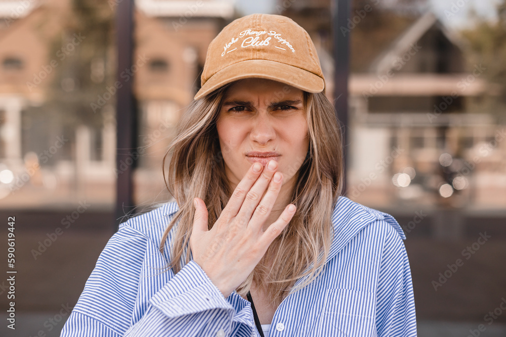 Evil blonde curly woman look angry at camera walking on the street ...