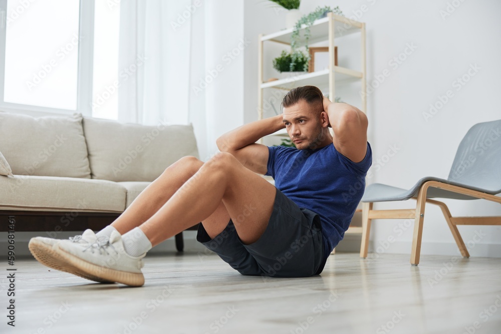 Man sportsman training at home, push-up exercises for arm, leg and back ...