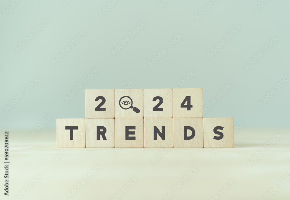 2024 trend concept. Wooden cube with 2024, magnifying glass, TRENDS ...