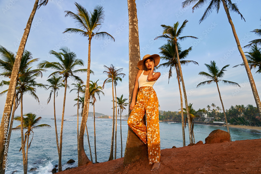 Young African Female Model Posing In Colorful Clothes At Tropical