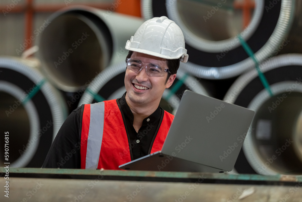 happy man engineer technical department using laptop working in power ...