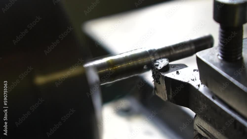 Close-up lathe machine operation by cutting the metal tube. vintage ...