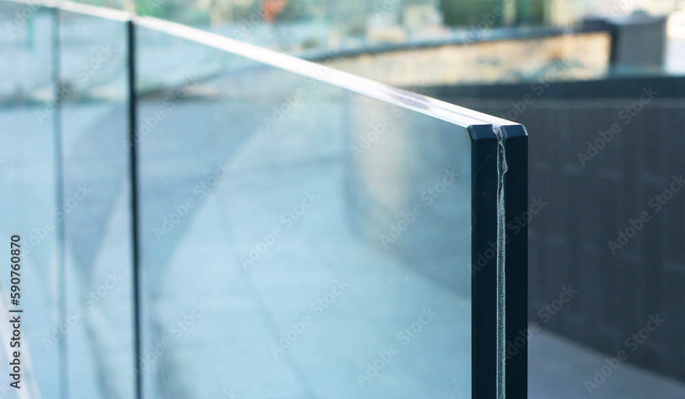 Frameless laminated glass railing exterior installation. Stock Photo ...