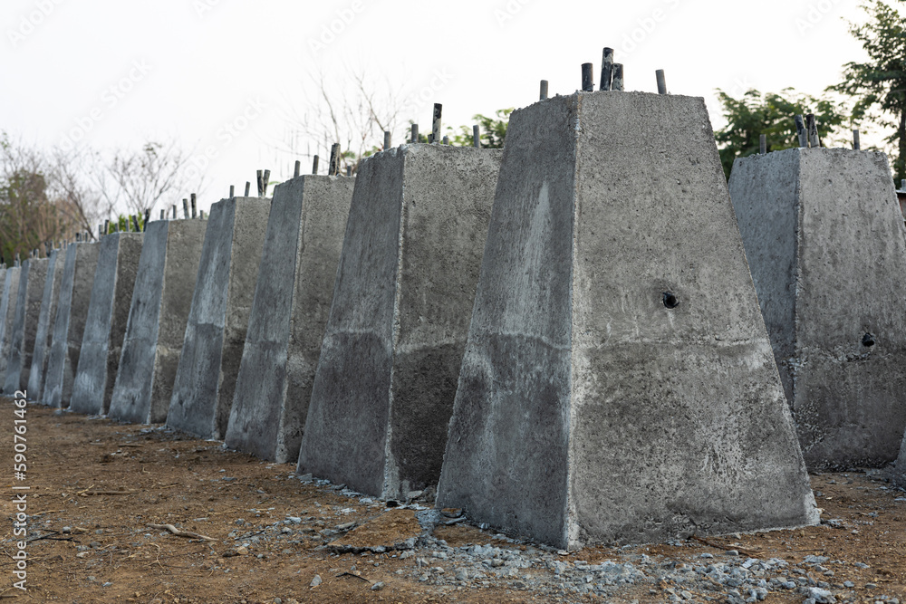 Numerous concrete pillar bases, which were built by cement casting in a ...