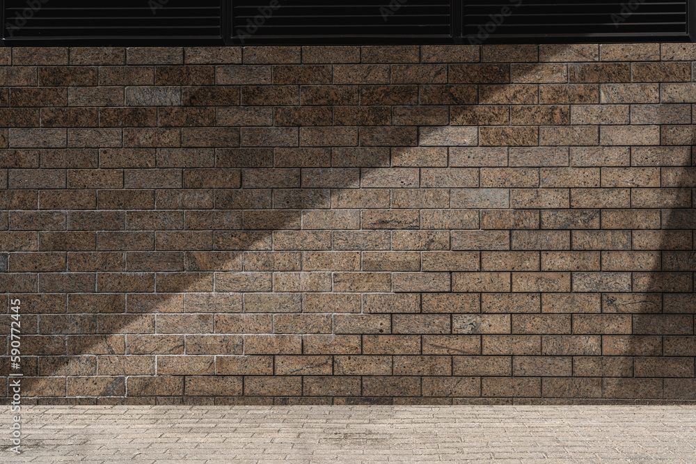 Brick wall with ventilation grilles providing a unique backdrop for ...