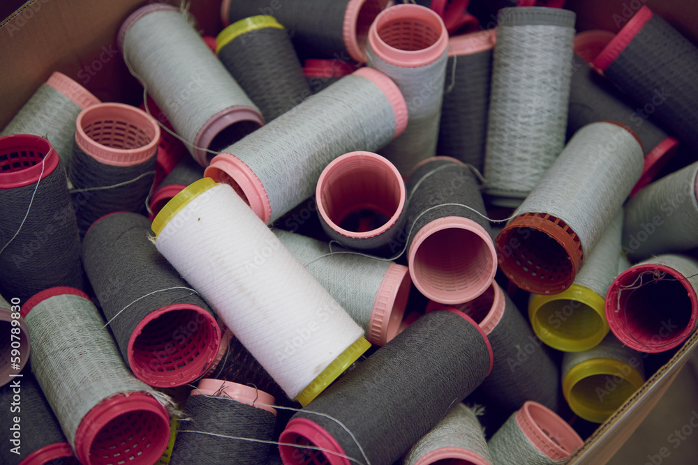 Raw spindles of industrial cotton in a weaving factory, hand weaving ...