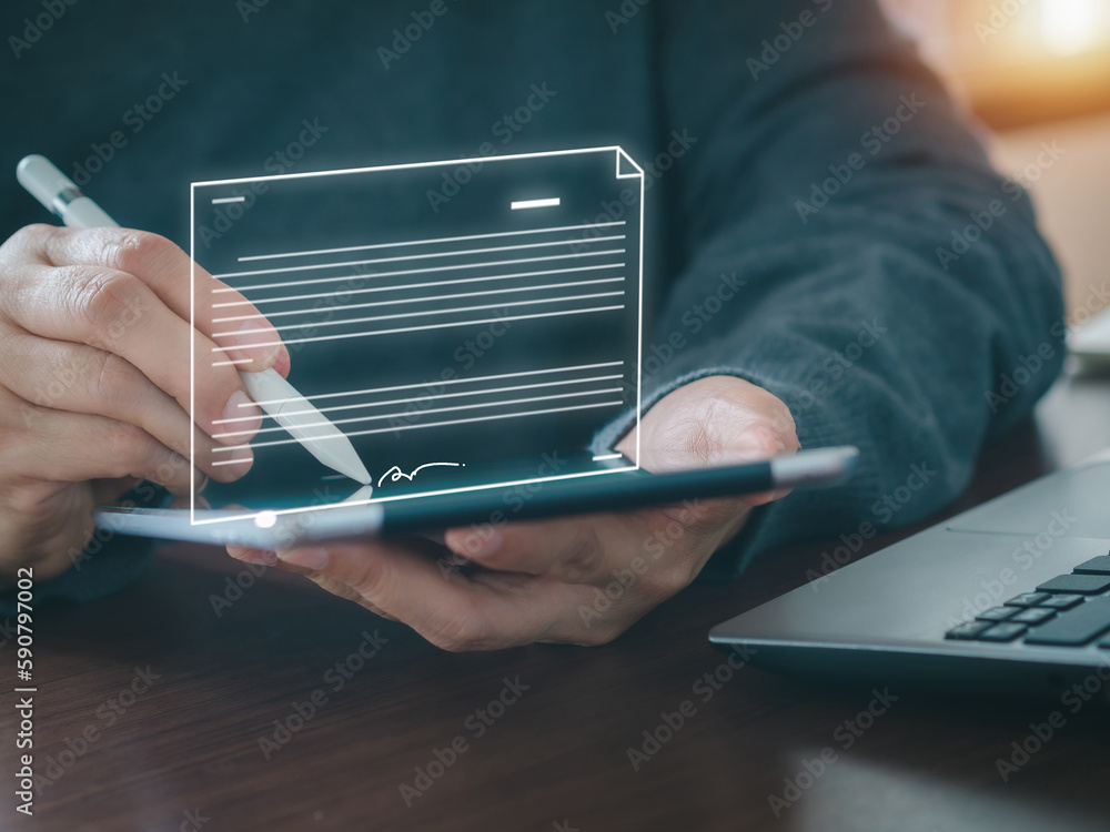 Businessman signs electronic documents on virtual digital tablet screen ...