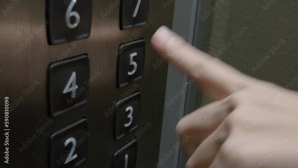 Pushing Elevator Button. Hand pressing lift button up to high floor of ...
