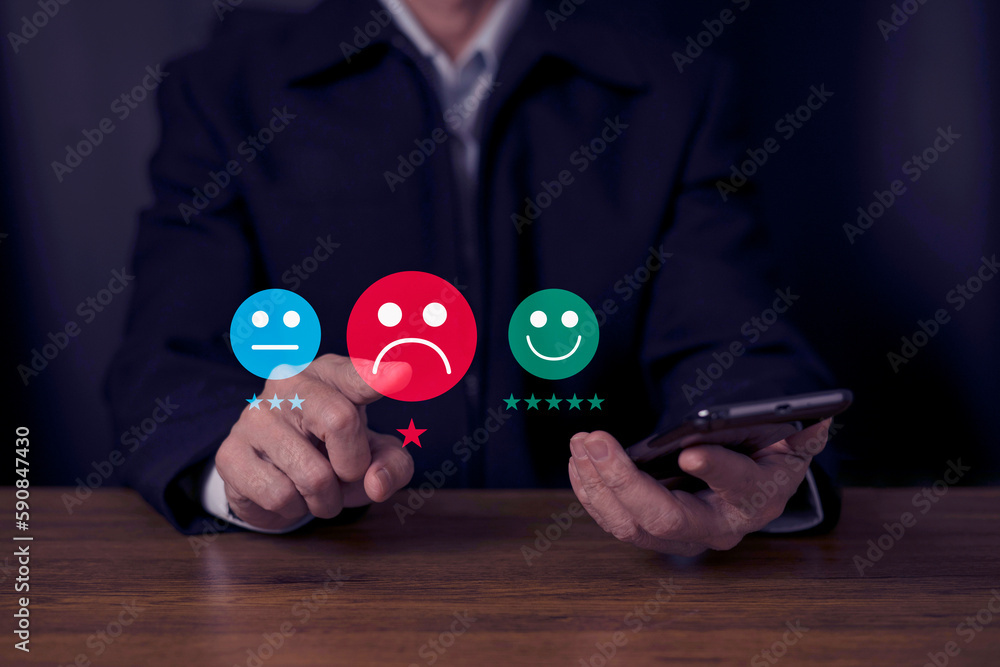 Unhappy Client hand pressed the smile face emoticon on the virtual ...