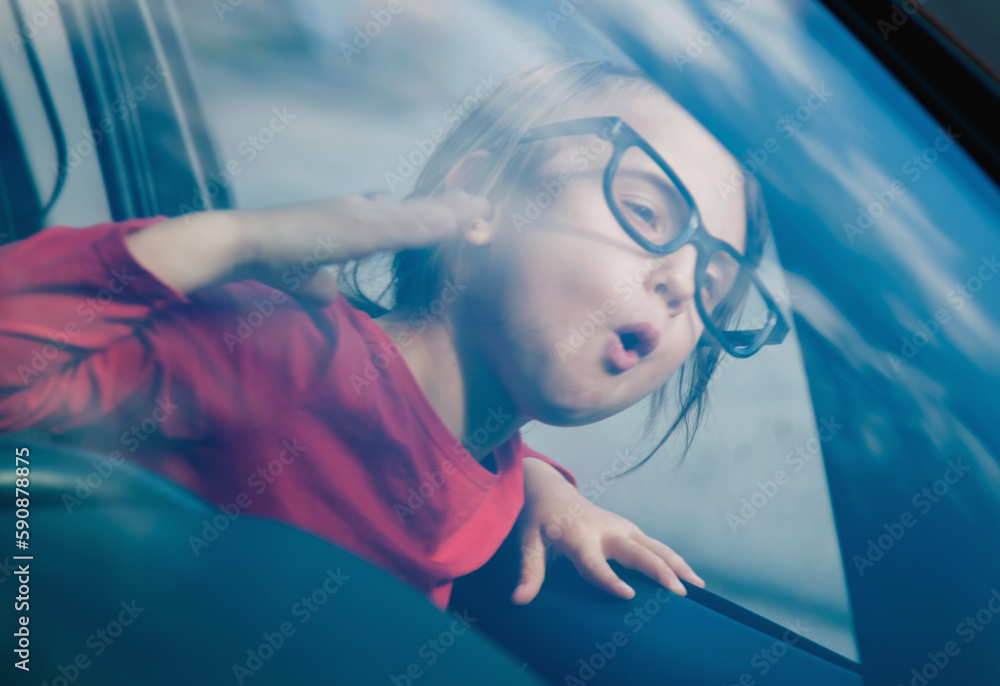 Foto de Humorous photo of angry little child girl driver gesturing with ...