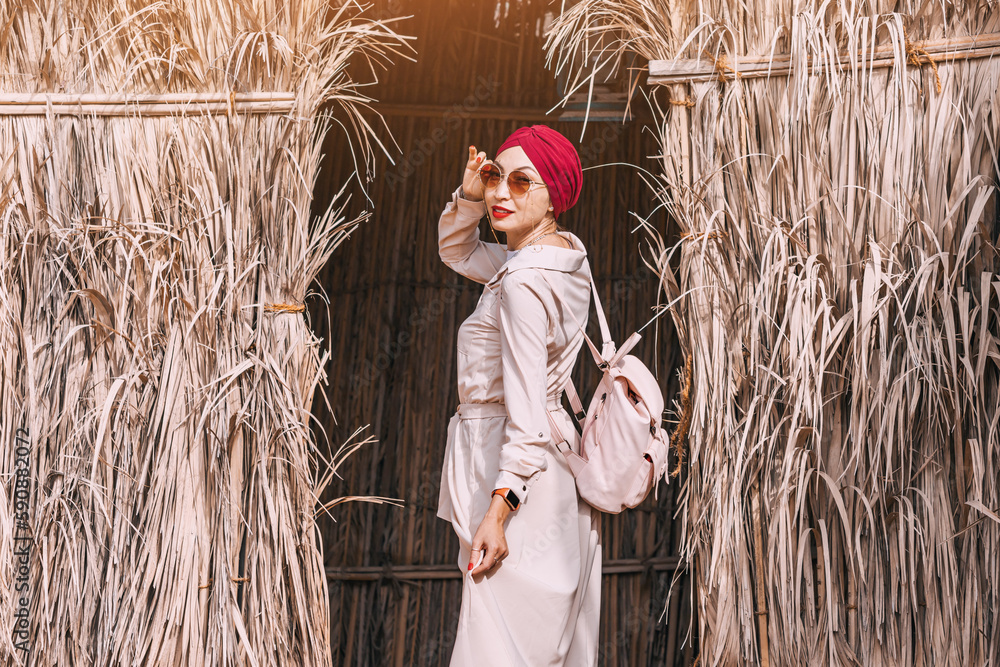 Girl in indian turban exploring arabian heritage village in Abu Dhabi ...