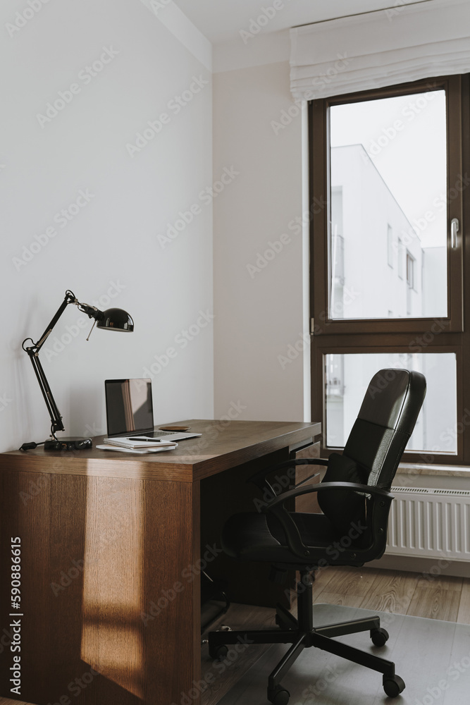 Workspace with laptop computer, lamp, table, chair. Work, study at home ...