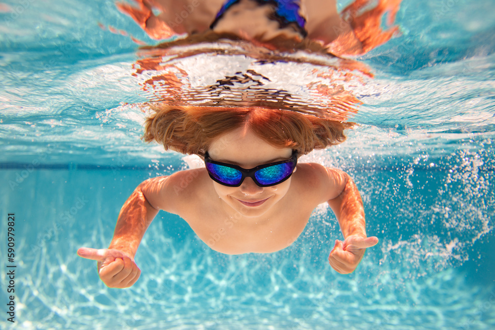 Child in swimming pool underwater. Kid underwater swim. Child splashing ...