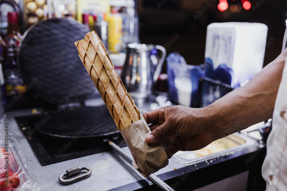 hand preparing Marquesitas mexican dessert traditional in Yucatan and ...