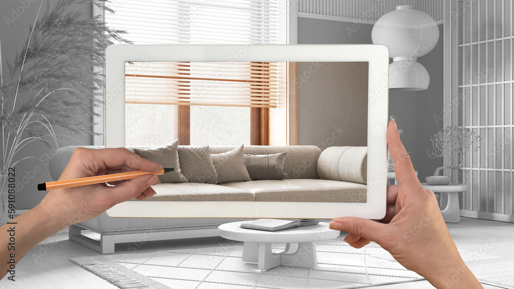 Augmented reality concept. Hand holding tablet with AR application used ...