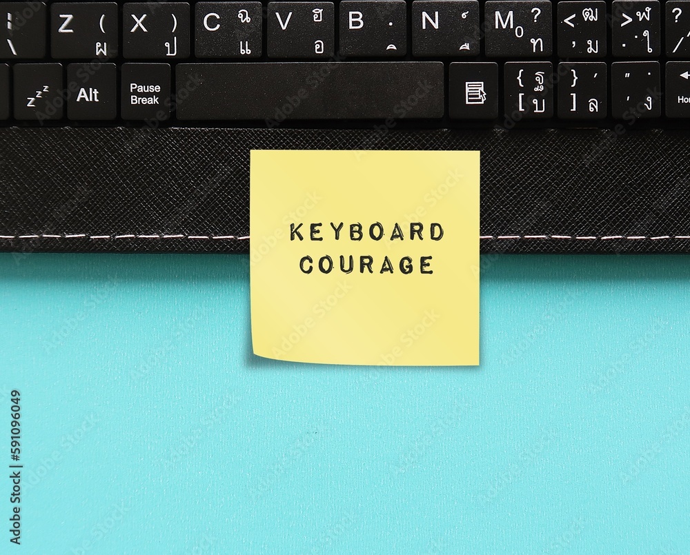 Keyboard on blue copy space background with text written note KEYBOARD ...