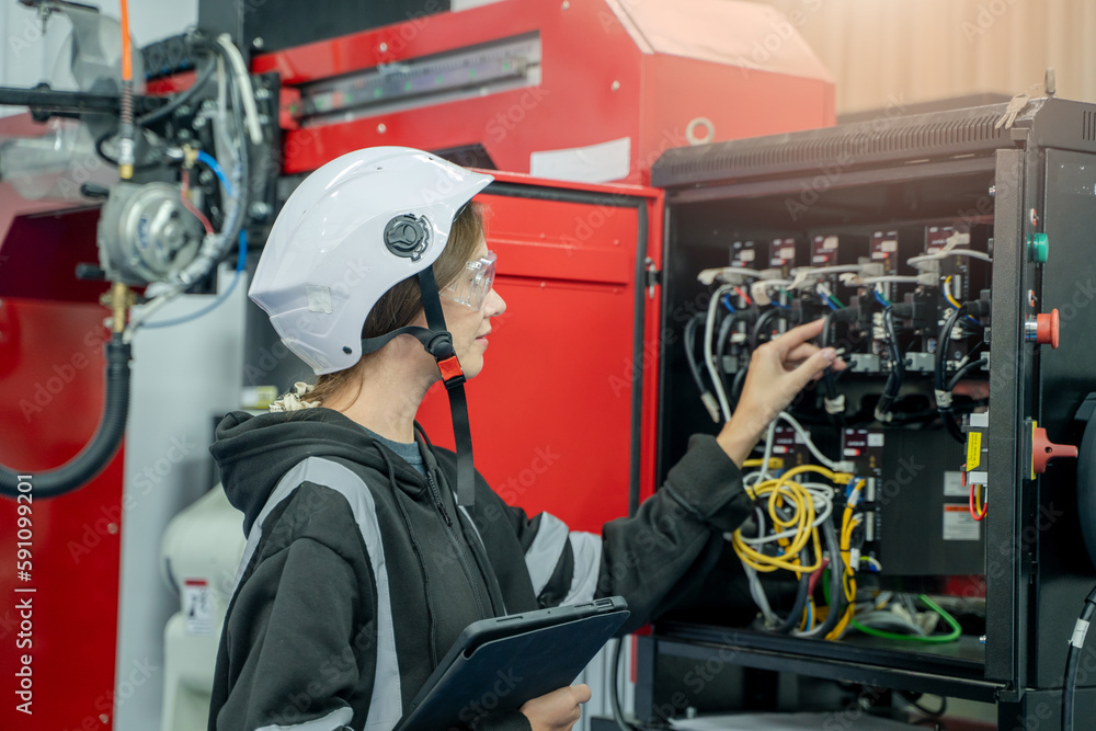 Electrical engineers working to test the voltage and current of the ...