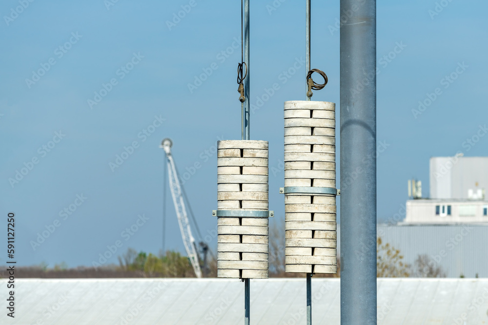 Electric train railway line tension pole with wires and concrete ...