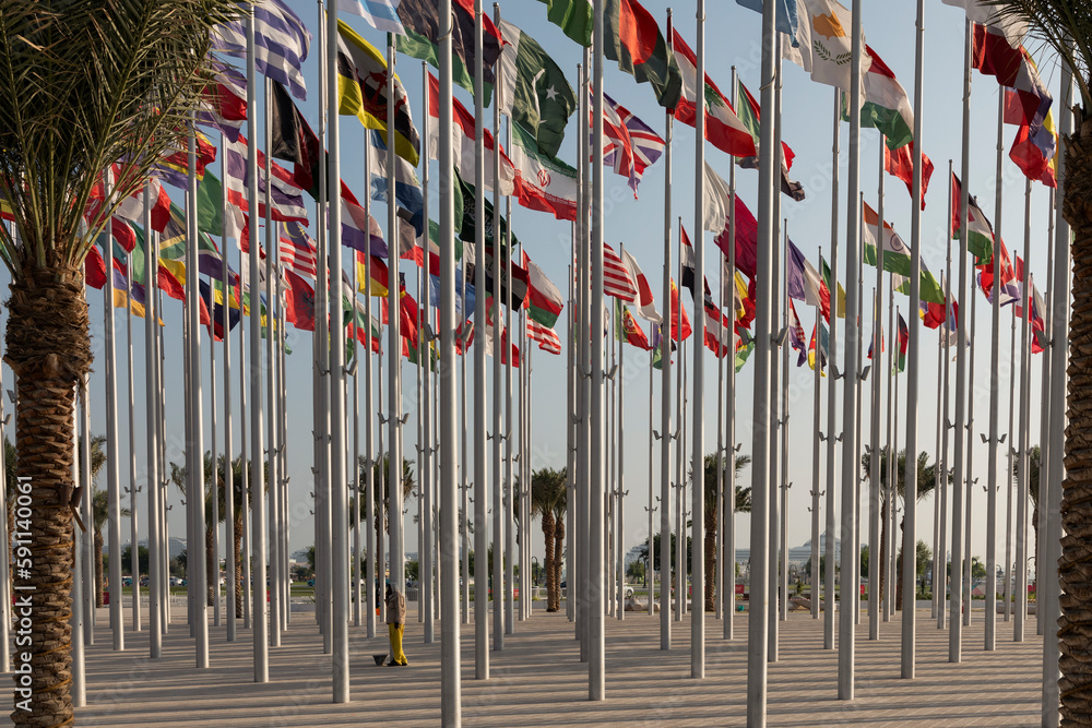 Doha, Qatar - December 12 2022: Flags of countries in the old port of ...