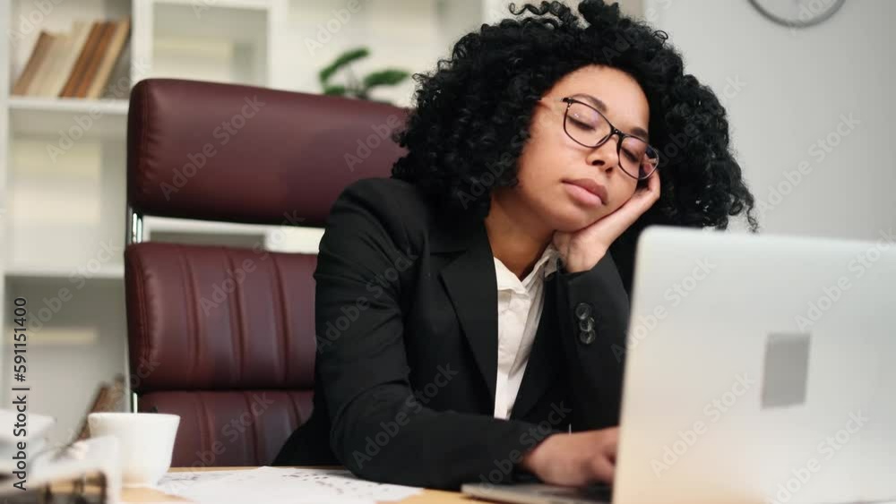 Tired exhausted young african american businesswoman sleeping dozing on ...