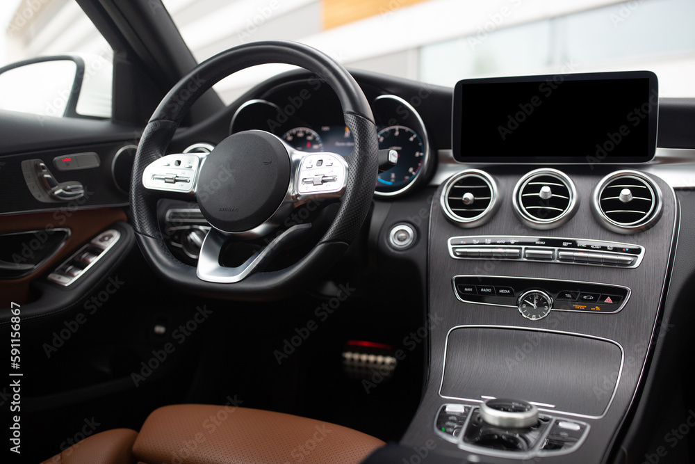 Modern luxury interior of car with leather seats big multimedia monitor ...