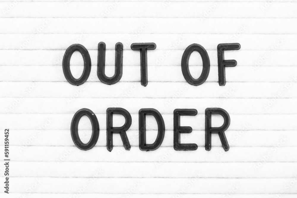 Black color letter in word out of order on white felt board background ...