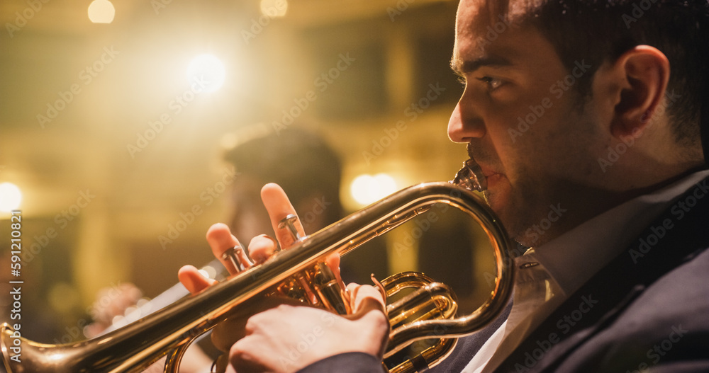 Cinematic Closeup of a Male Trumpet Player Reading a Music Sheet and ...