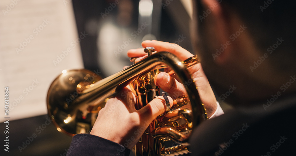 Cinematic Closeup of the Hands of a Male Trumpet Player Reading a Music ...