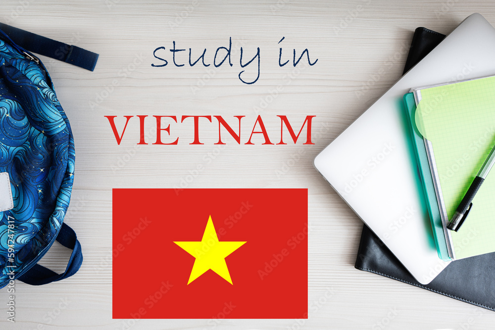 Study in Vietnam. Background with notepad, laptop and backpack ...