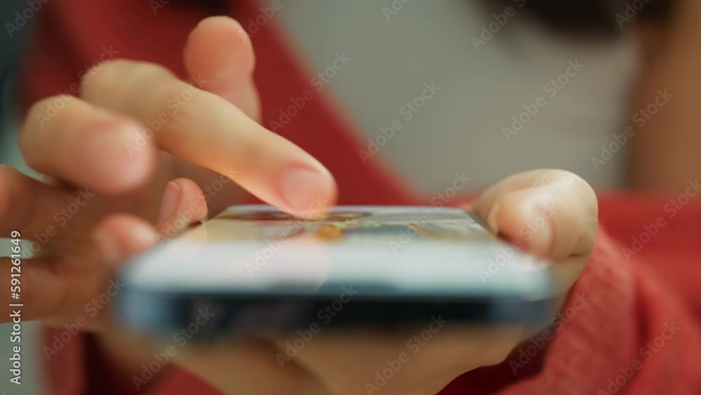 Use of mobile phone in shining warm sunny day light. Woman hands ...