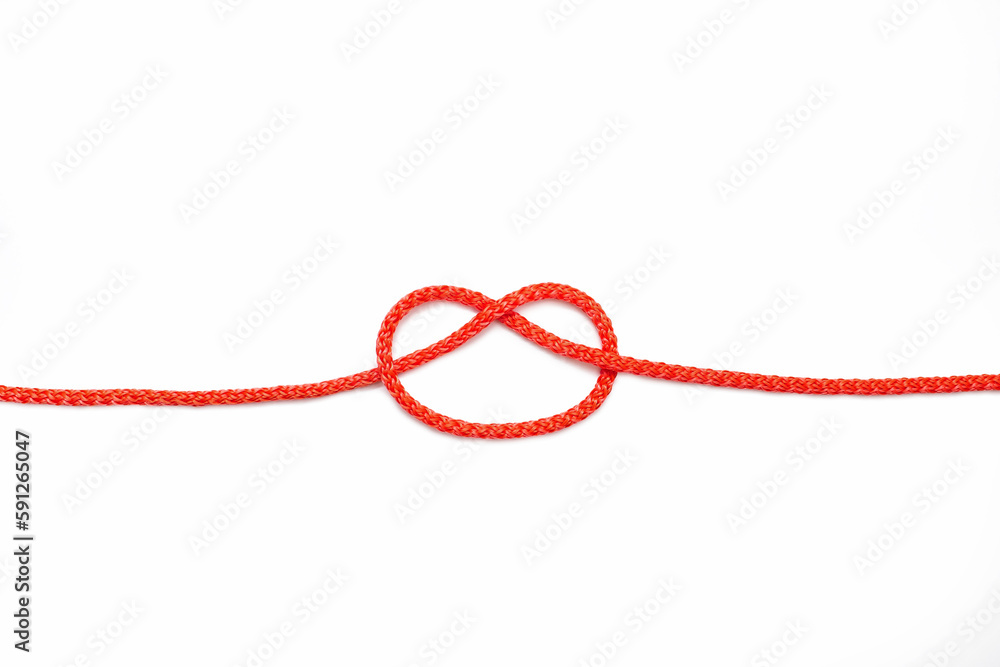 Red rope with a knot not completely tied on a white isolated background ...