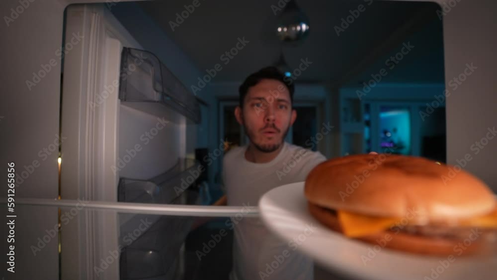 Vidéo Stock Refrigerator point of view joyful young man opening ...