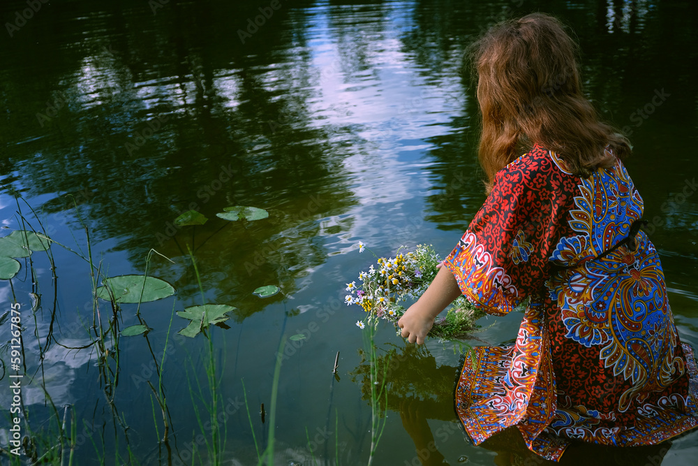 girl stand in river holding flower wreath, abstract natural background ...