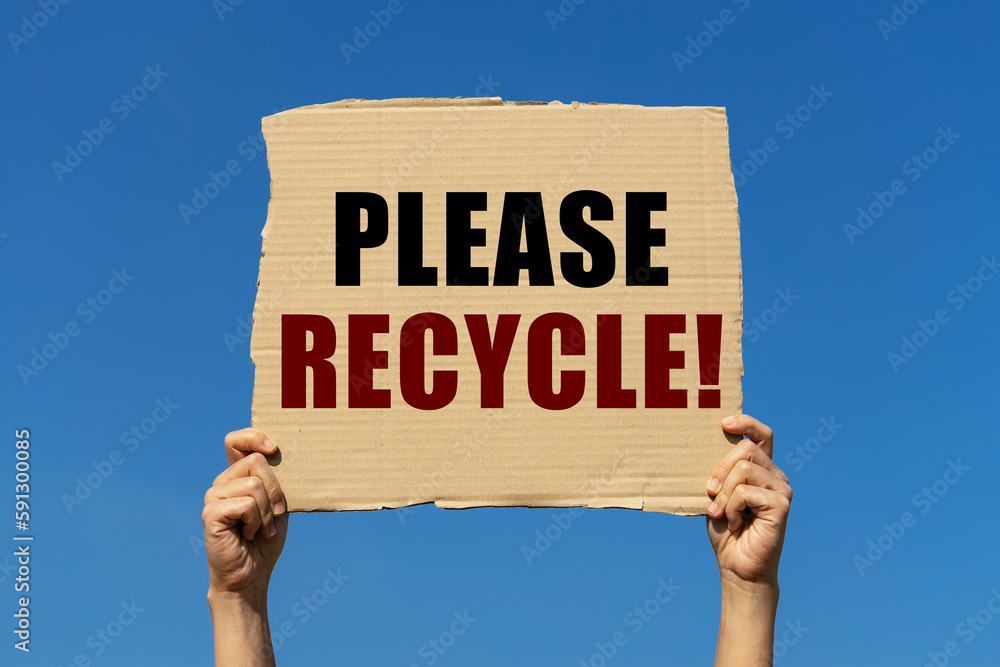 Please recycle text on box paper held by 2 hands with isolated blue sky ...