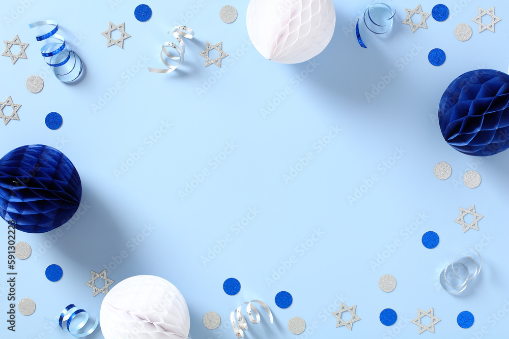 Frame of Jewish holidays decorations and confetti on blue table ...