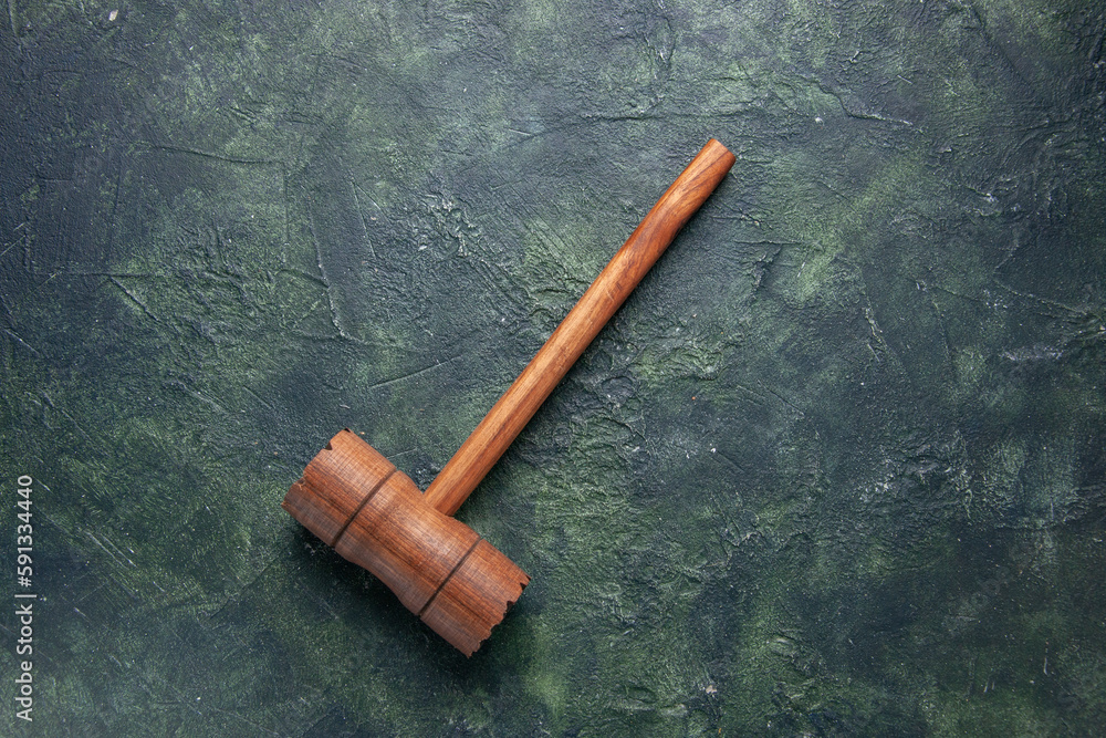 top view wooden hammer for meat beating on a dark background kitchen ...