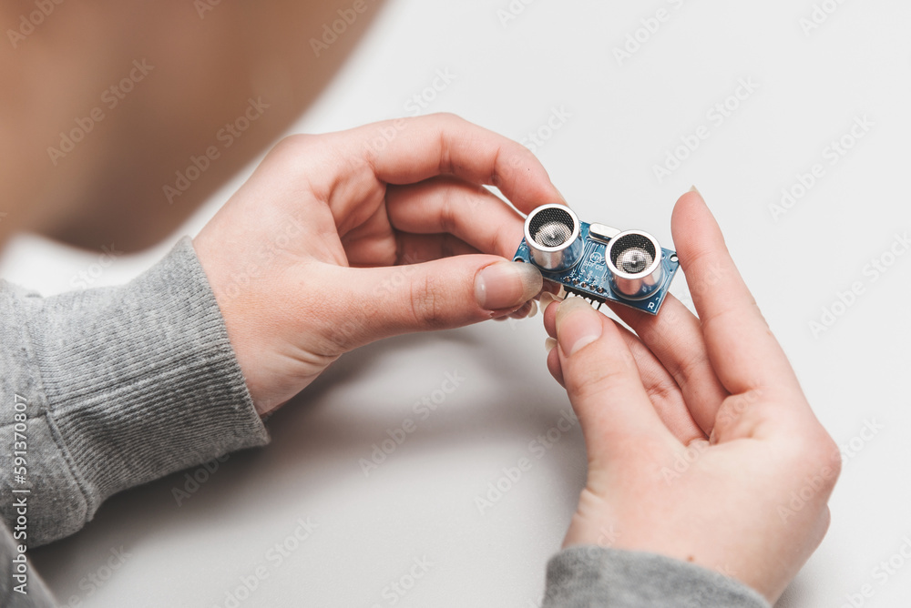 Student girl Learning To Program Robot Ultrasonic distance sensors ...