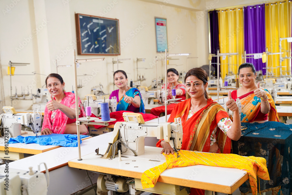 Indian women group working on sewing machine at textile factory. Stock ...