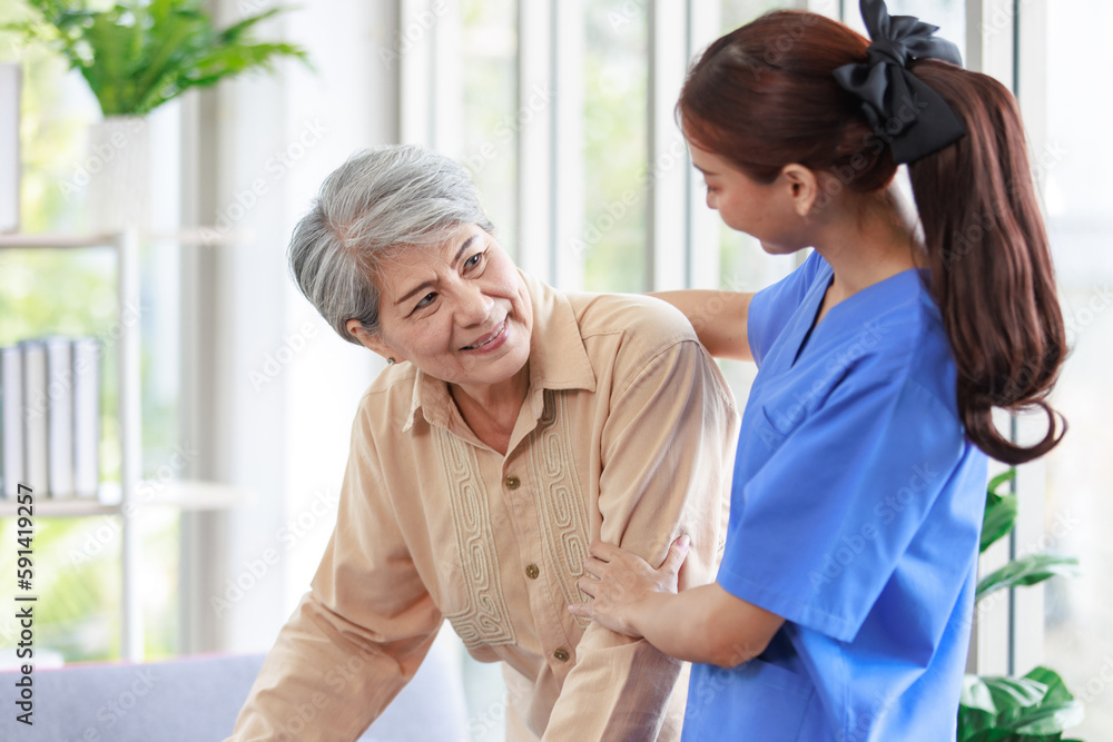 Asian young professional successful friendly female nurse in blue ...
